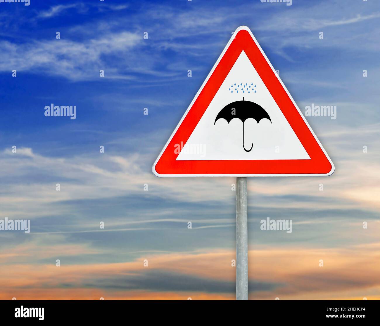 Triangle road sign umbrella on rod Stock Photo - Alamy