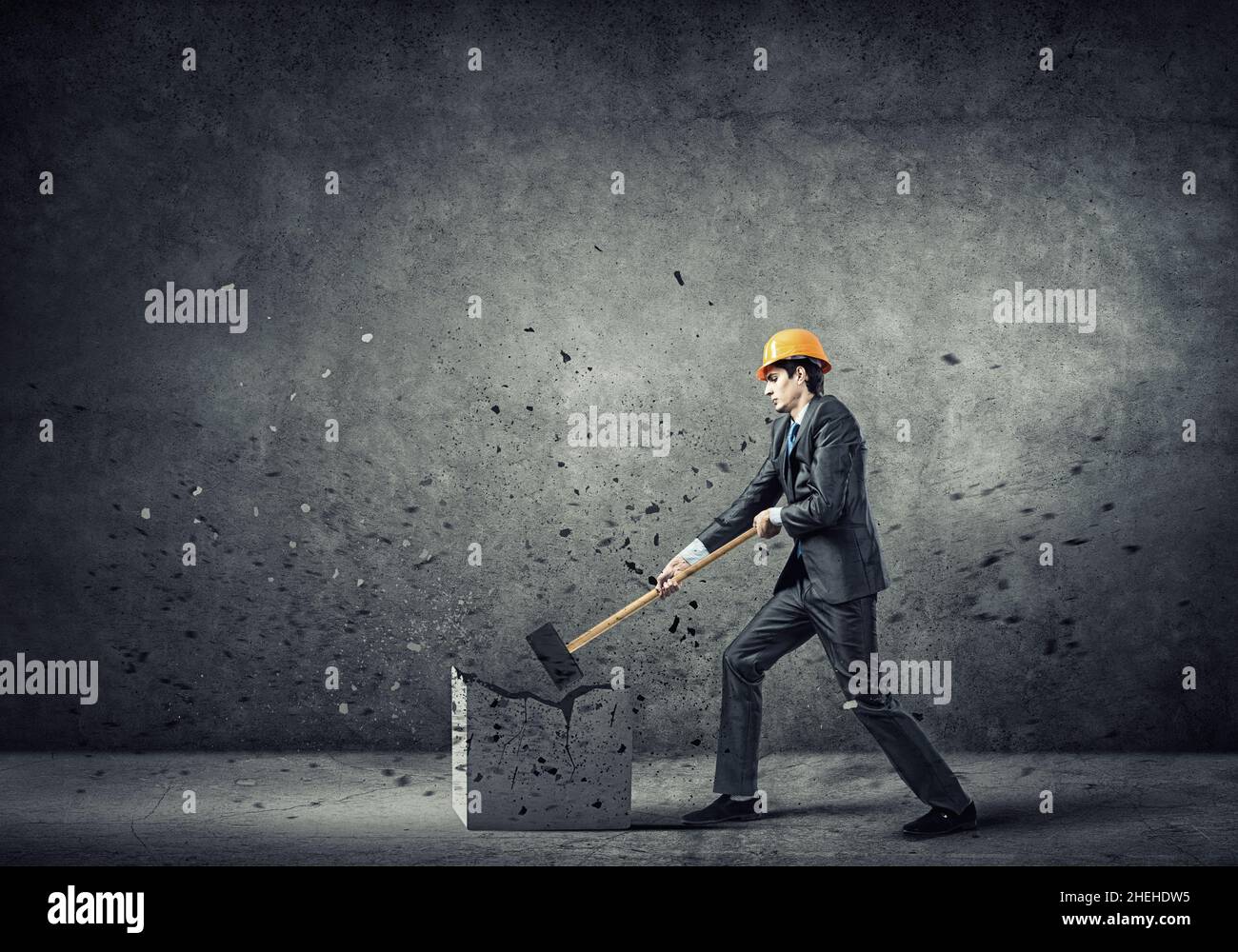 Engineer man break stone Stock Photo - Alamy