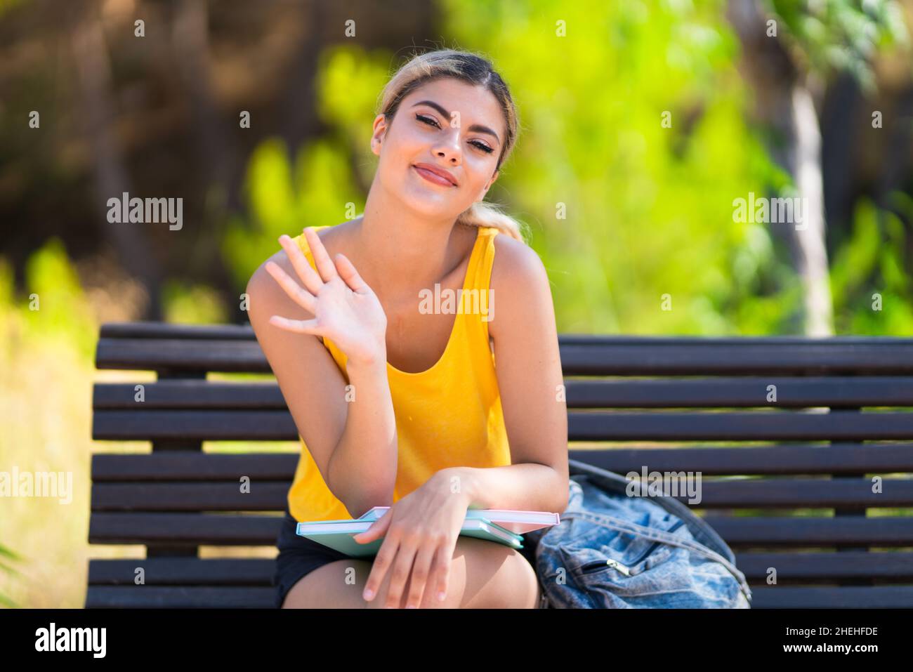 Teen waving goodbye hi-res stock photography and images - Alamy