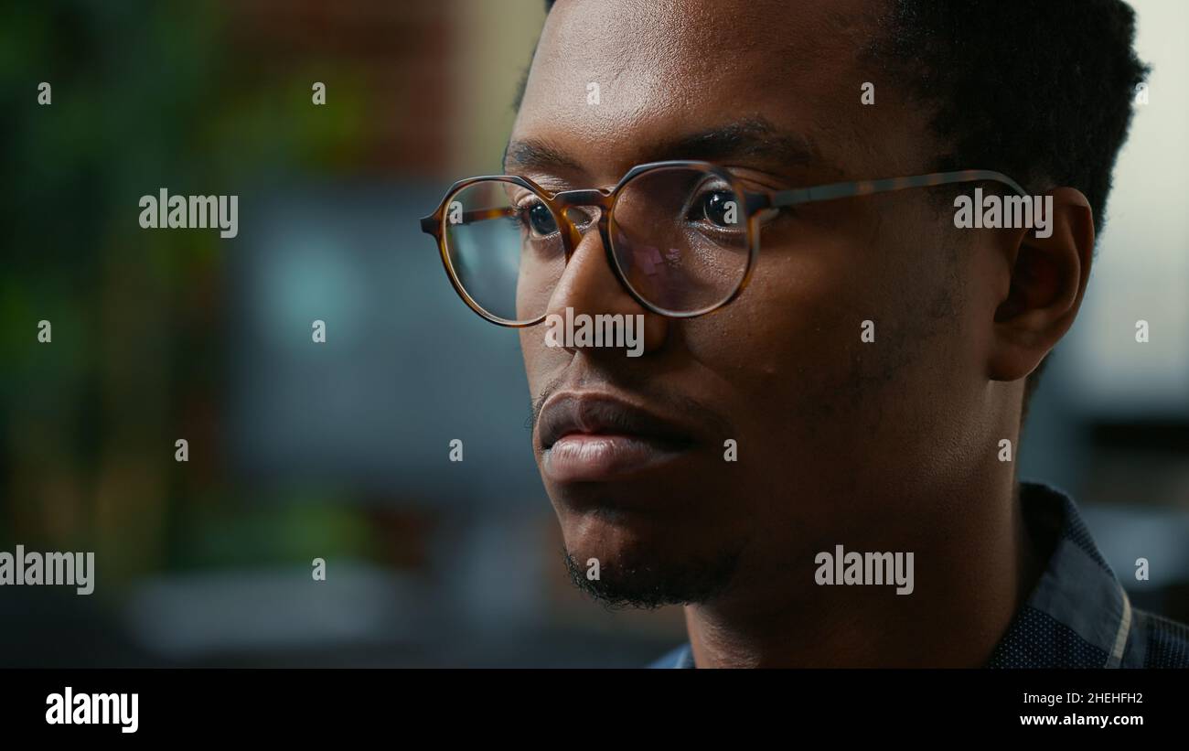 Focus on moving eyes of software developer writing code in front of ...