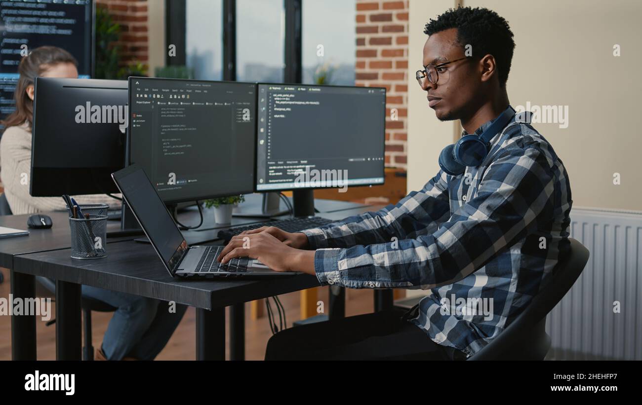 Focused programer fixing glasses typing hi-res stock photography and ...