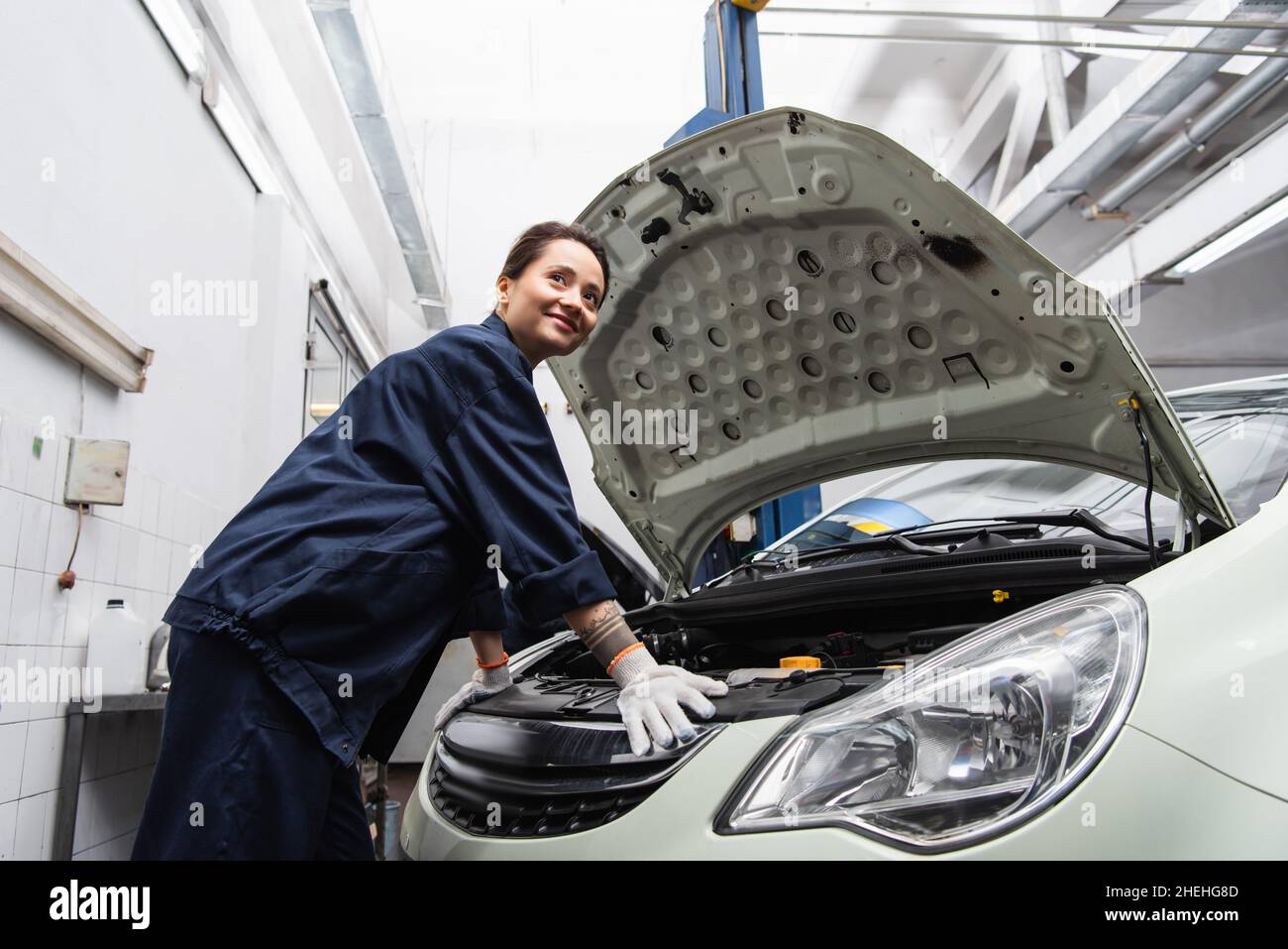 Mechanic in uniform standing hi-res stock photography and images - Alamy