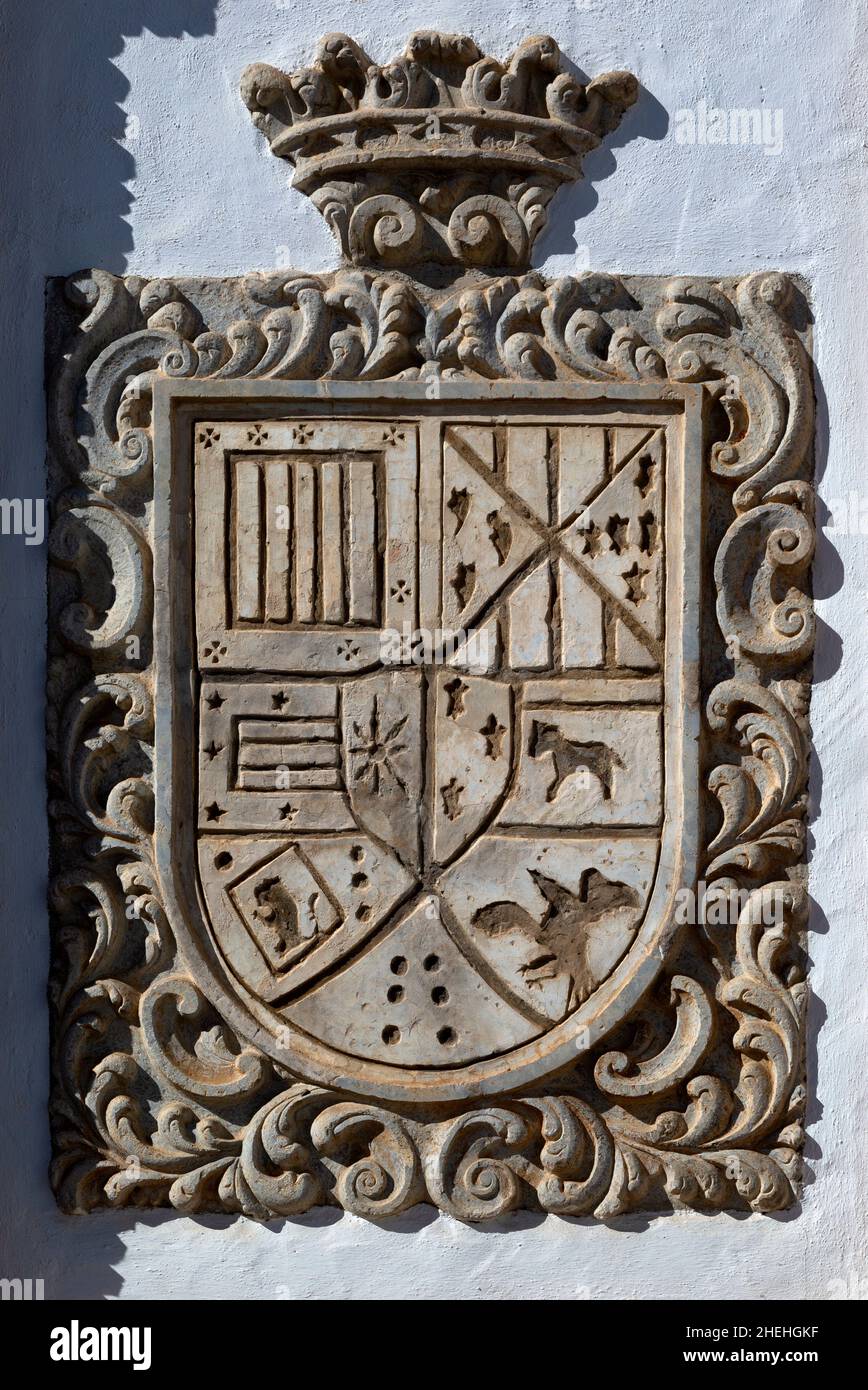 Stone heraldic family Coat of Arms on wall of building, Frigiliana ...