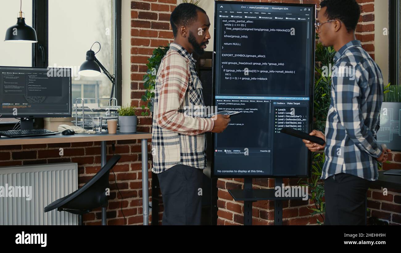 Team Of Software Engineers Leaving After Analyzing Source Code On Wall Screen Tv Comparing 8514