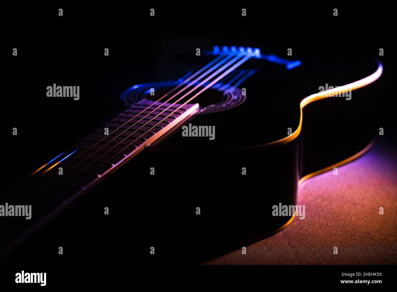 black guitar split colored concept. guitar music dark shoot Stock Photo ...