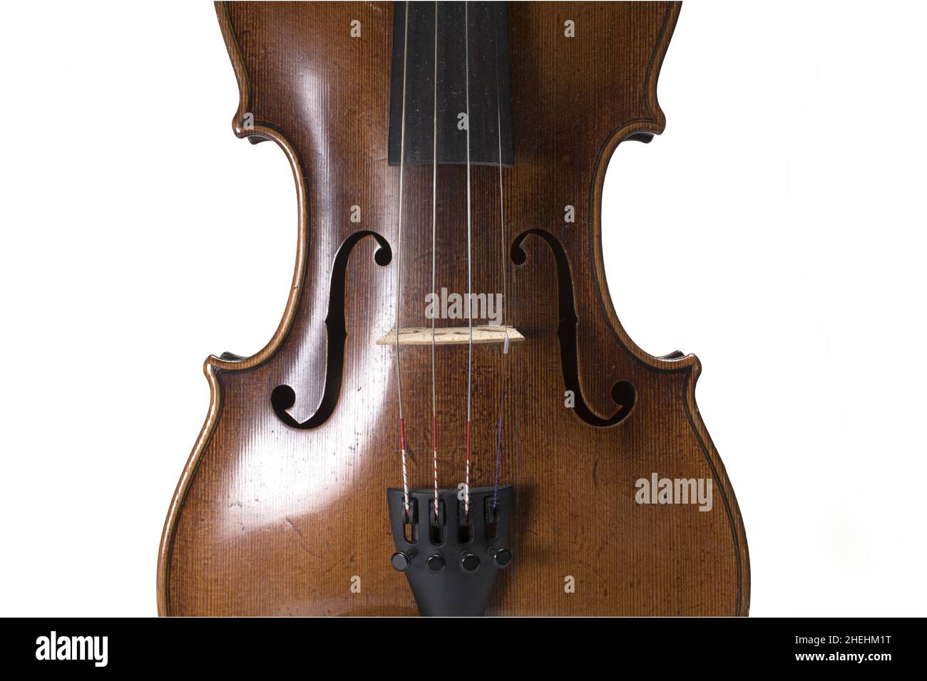 Close up of sound body and strings of old violin with sound holes on ...