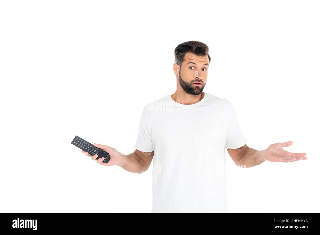 confused man with tv remote controller showing shrug gesture isolated ...