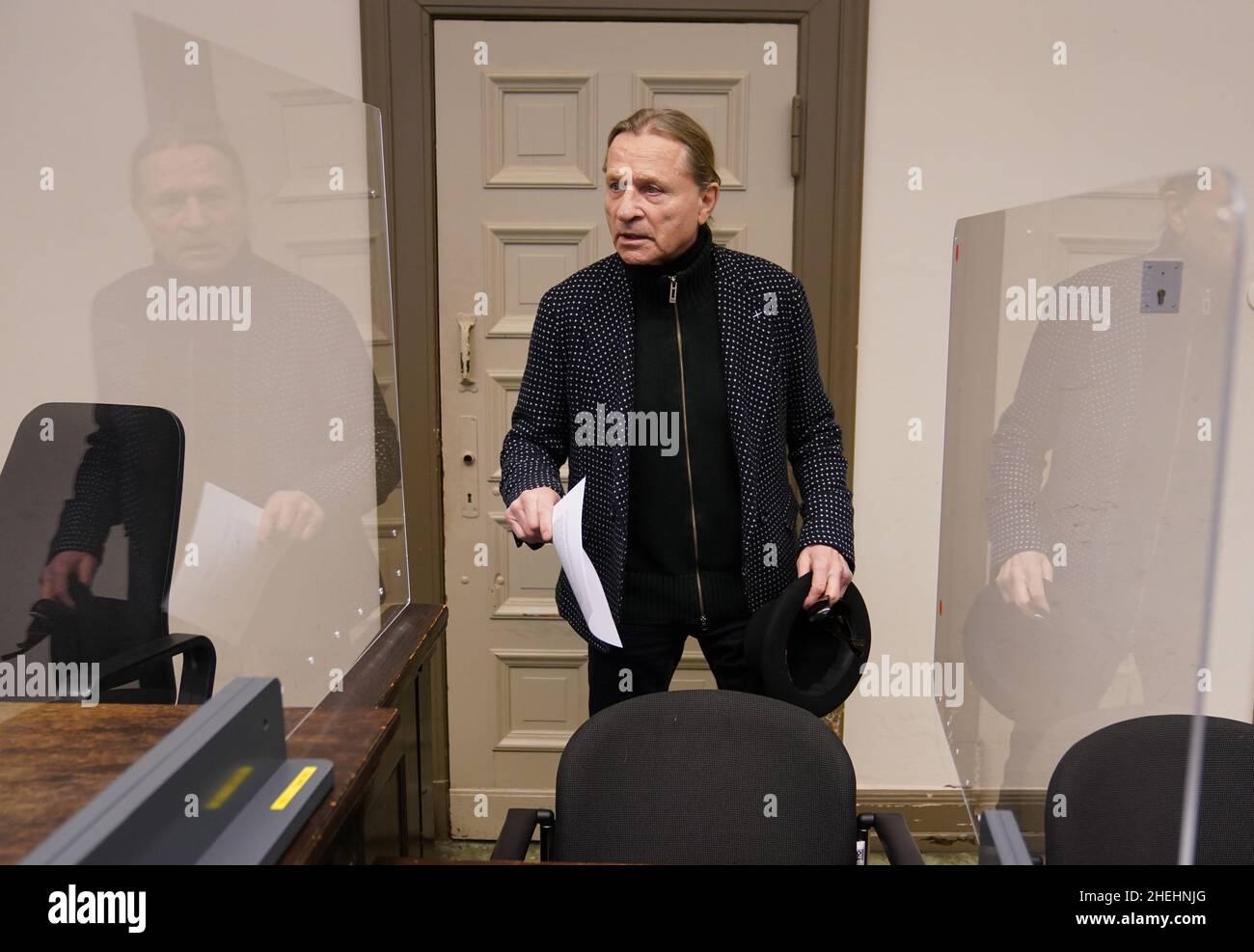 Hamburg, Germany. 11th Jan, 2022. The defendant Klaus Barkowsky stands ...