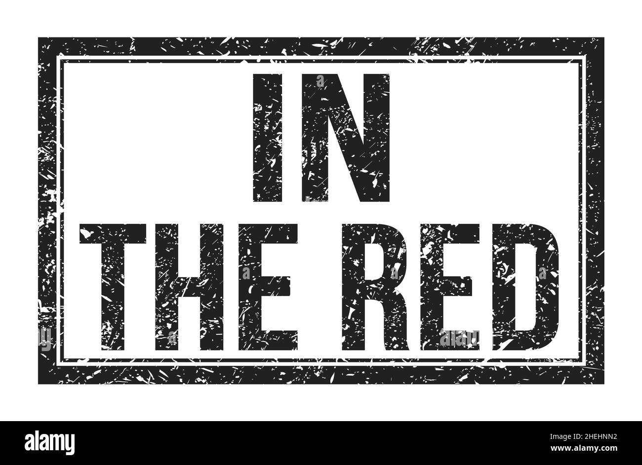 IN THE RED, words written on black rectangle stamp sign Stock Photo - Alamy