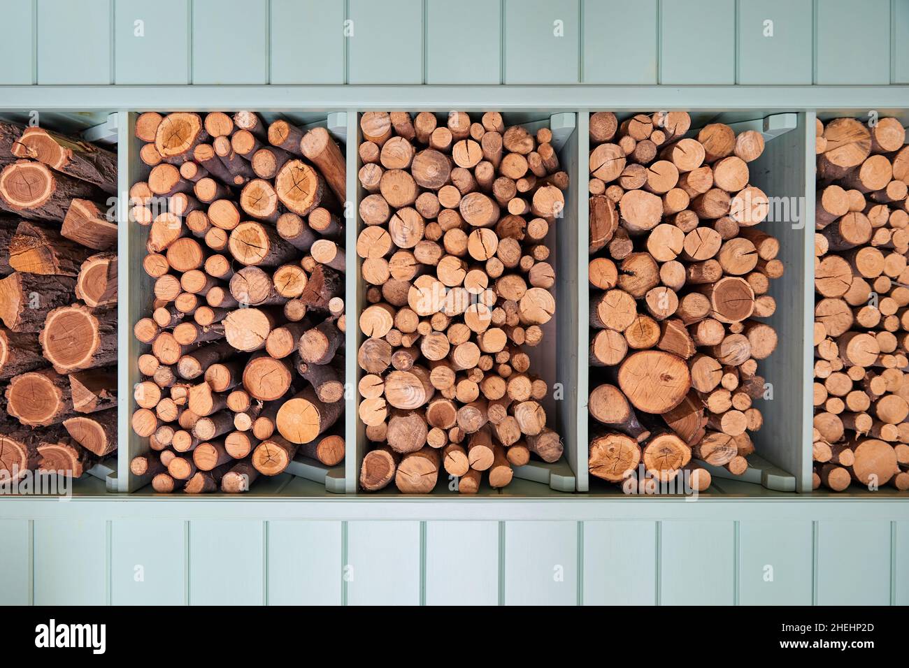 Firewood stacked in woodshed hi-res stock photography and images - Alamy