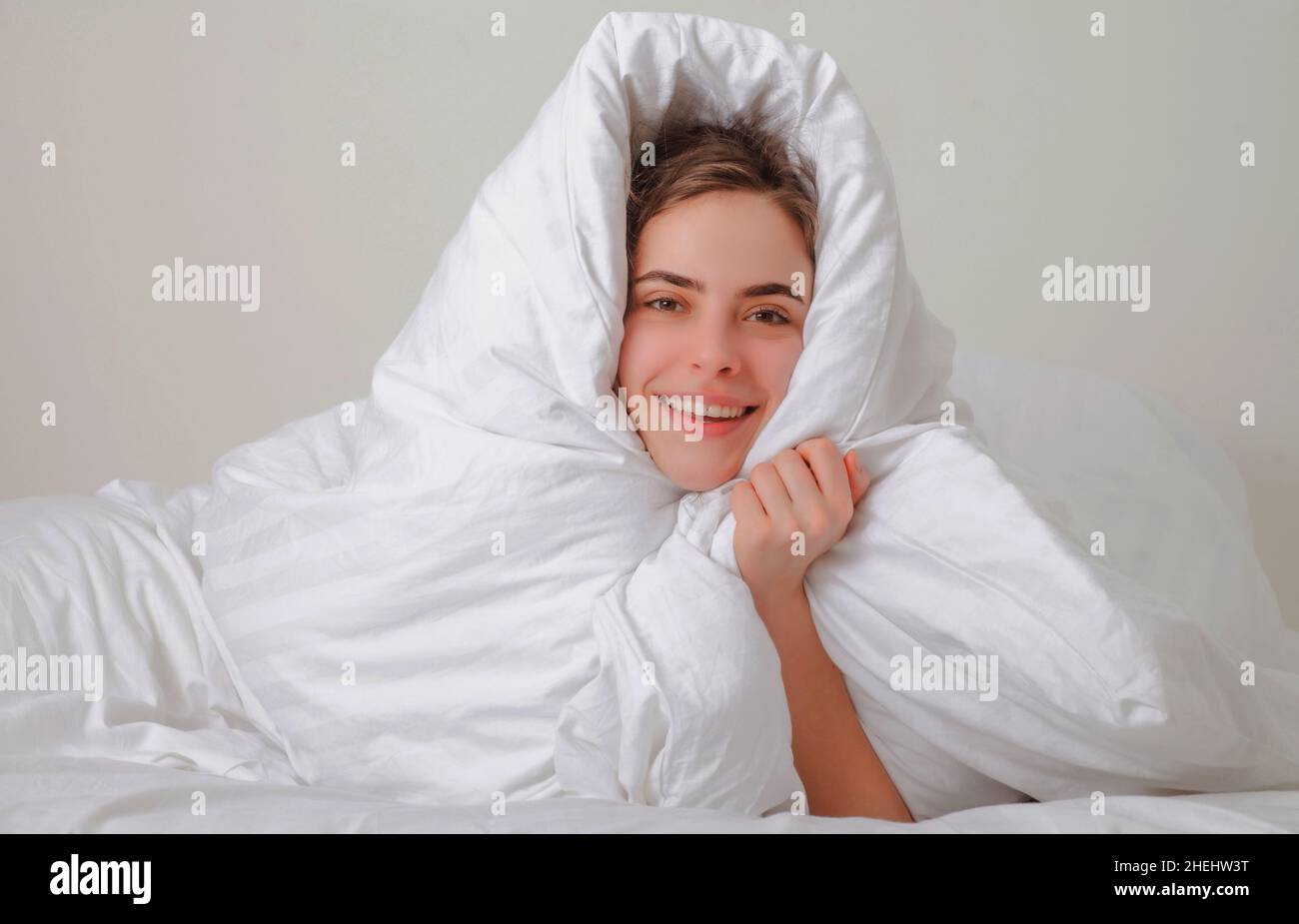 Woman lie in bed woke up after sleeping in morning, enjoy new day ...
