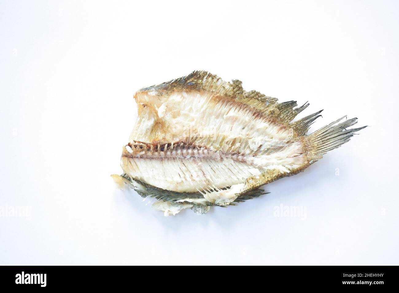 deep fried snake skin gourami half on white background Stock Photo - Alamy