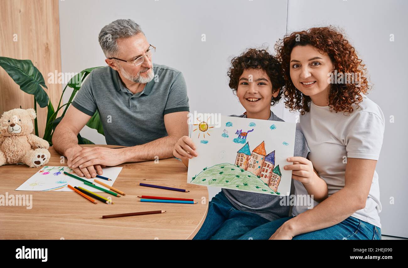 Children mental health . Cute boy having fun with mother during art ...