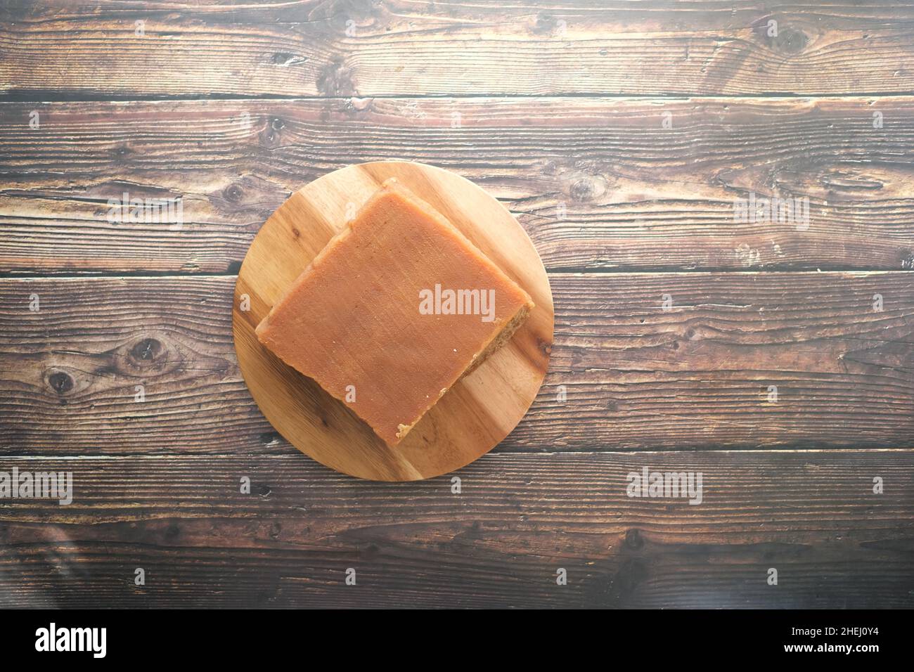 Jaggery traditional cane sugar cube on table Stock Photo - Alamy