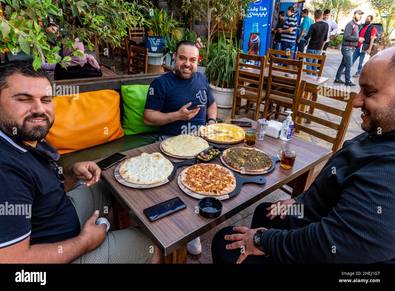 A Group Of Jordanian Men Eating A Traditional Breakfast Of Flatbreads ...