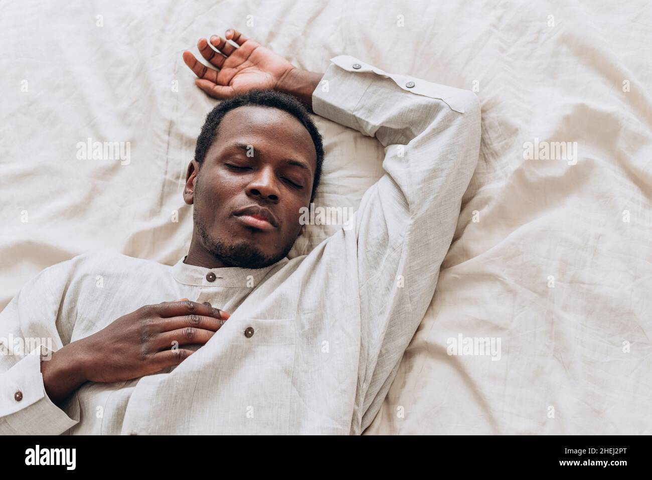 African man sleep bed hi-res stock photography and images - Alamy