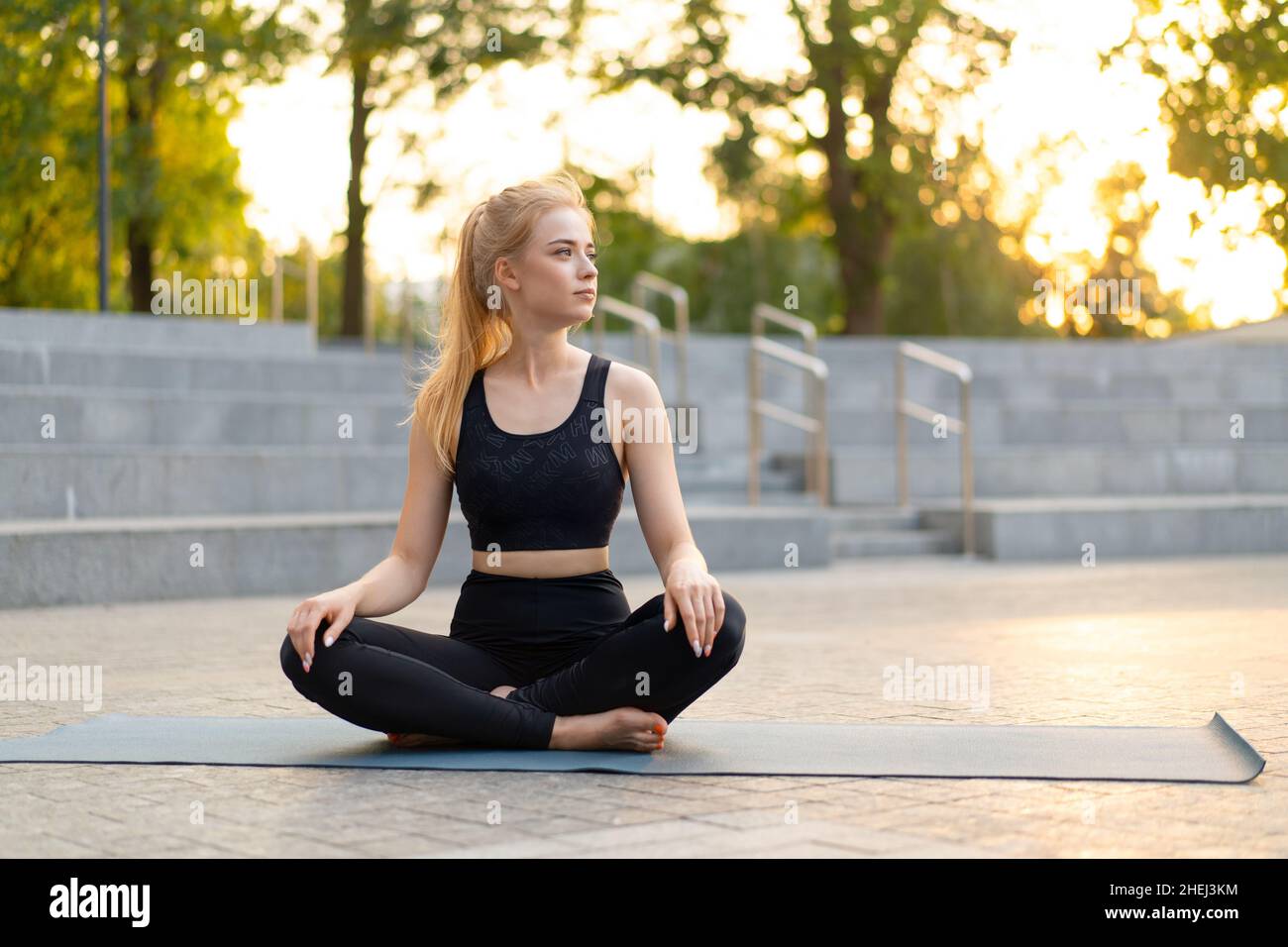 Yoga and Meditation in Modern City Caucasian Woman Relax Lotus Position ...