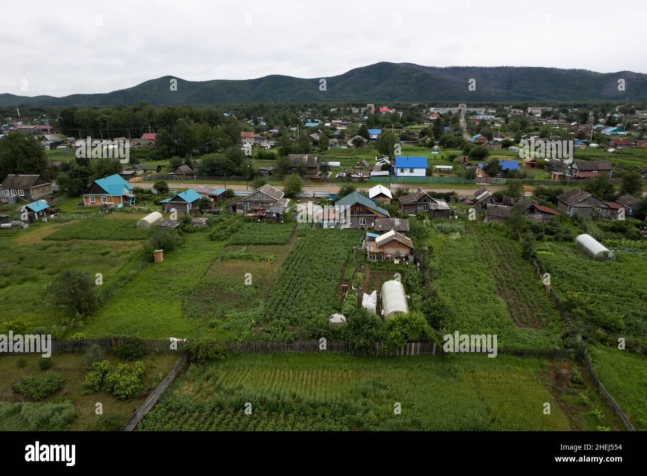 Aerial aerial view of a small village in a wooded area Stock Photo - Alamy