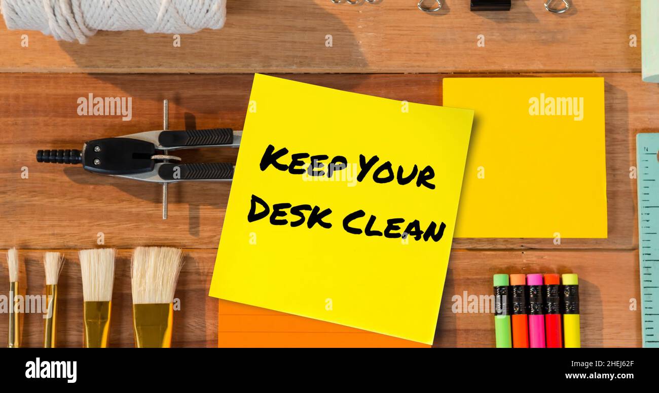 Image of keep your desk clean text over desk with stationery Stock ...