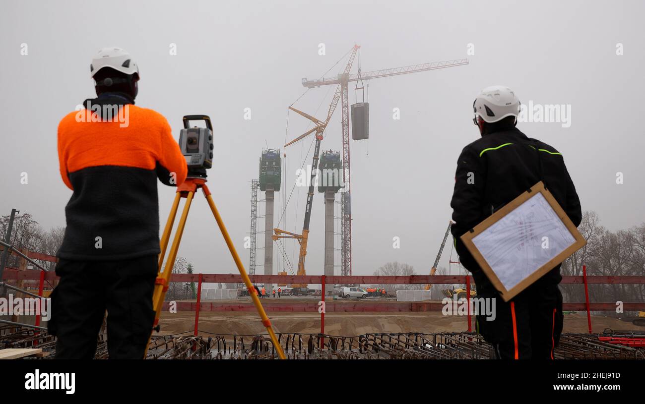 Magdeburg, Germany. 11th Jan, 2022. Surveyors observe the lifting of a ...