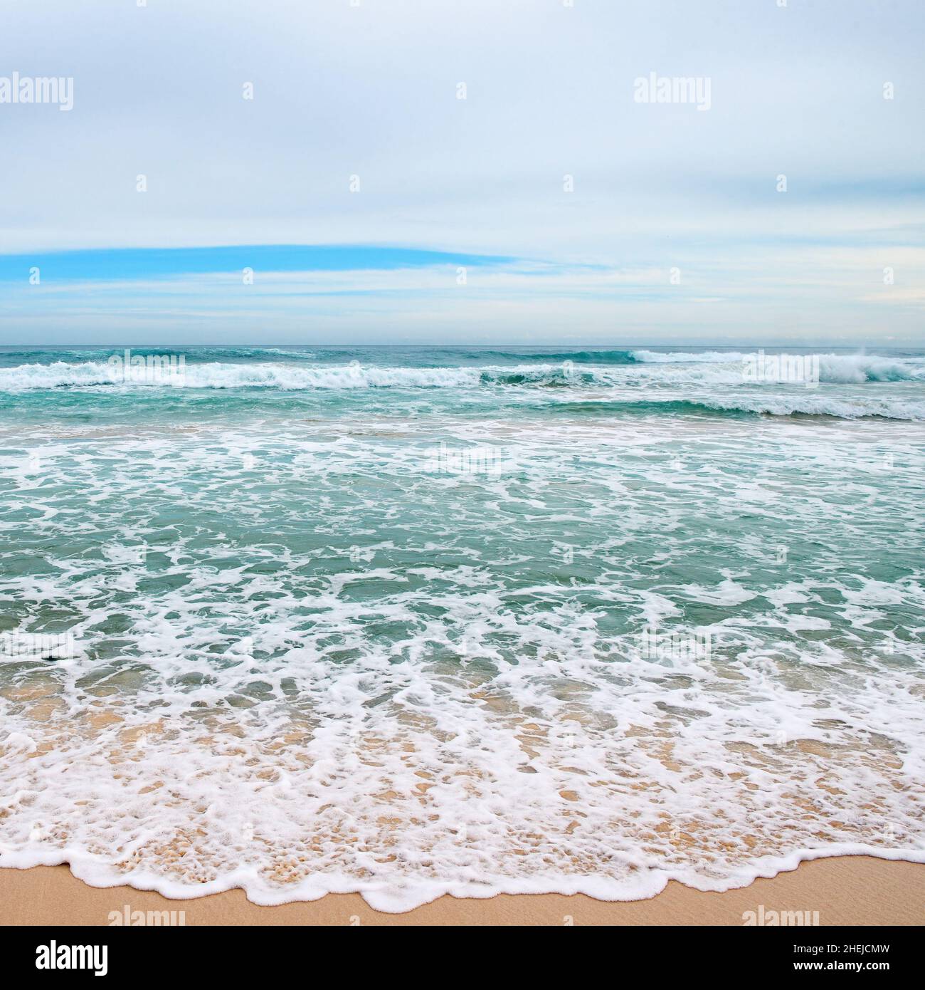 waves sea and yellow sand Stock Photo - Alamy