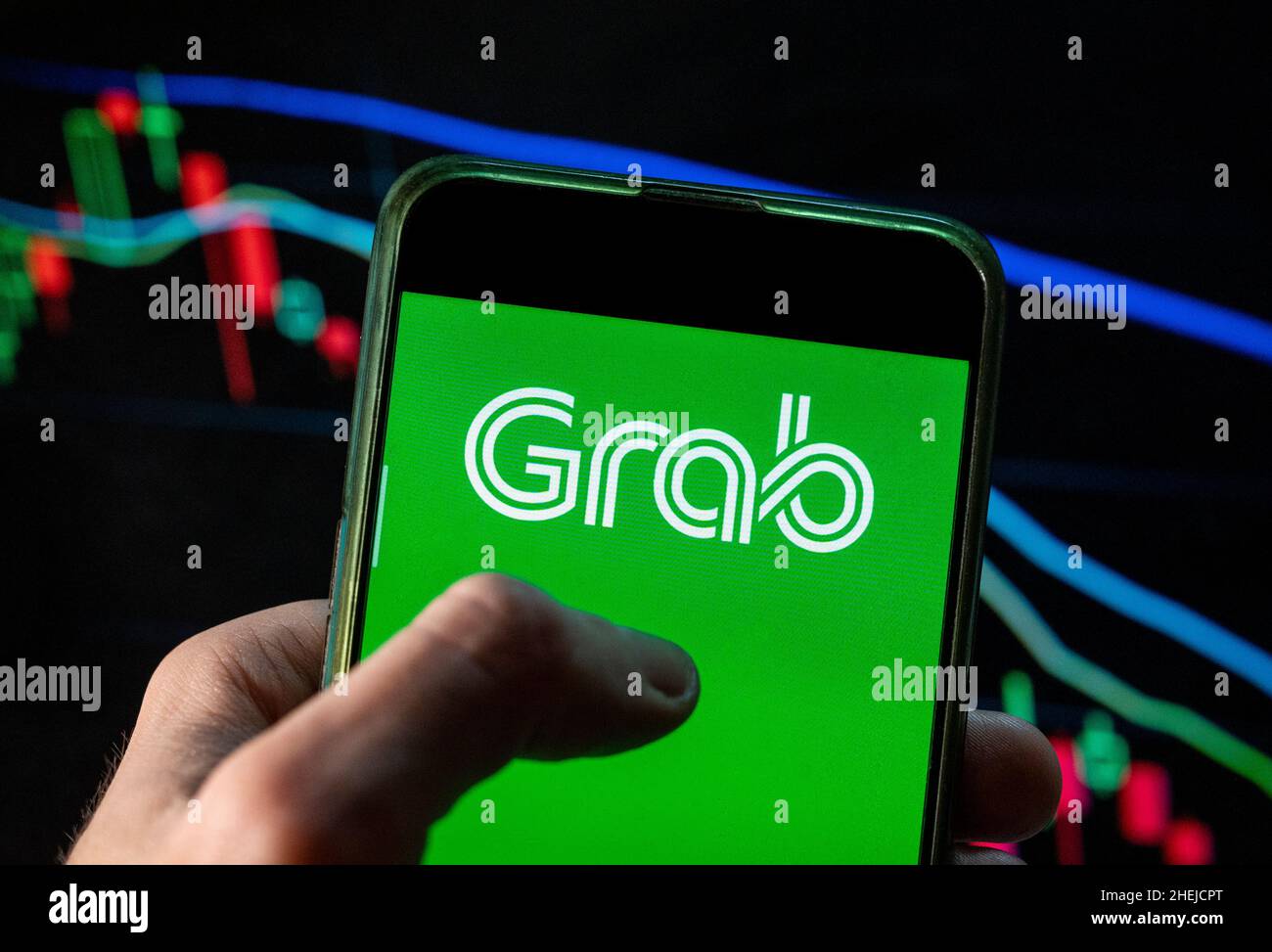 In this photo illustration the Singapore technology ride-sharing and ...