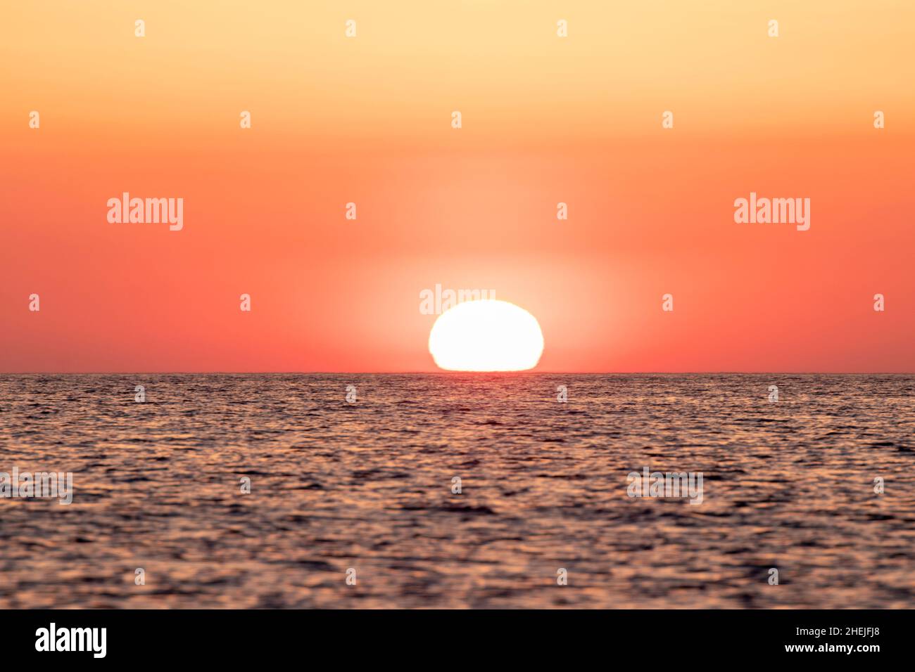 Sun rising over the sea hi-res stock photography and images - Alamy