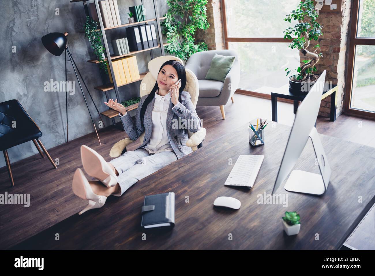 Full body photo of successful ceo lady sitting chair legs on desktop ...