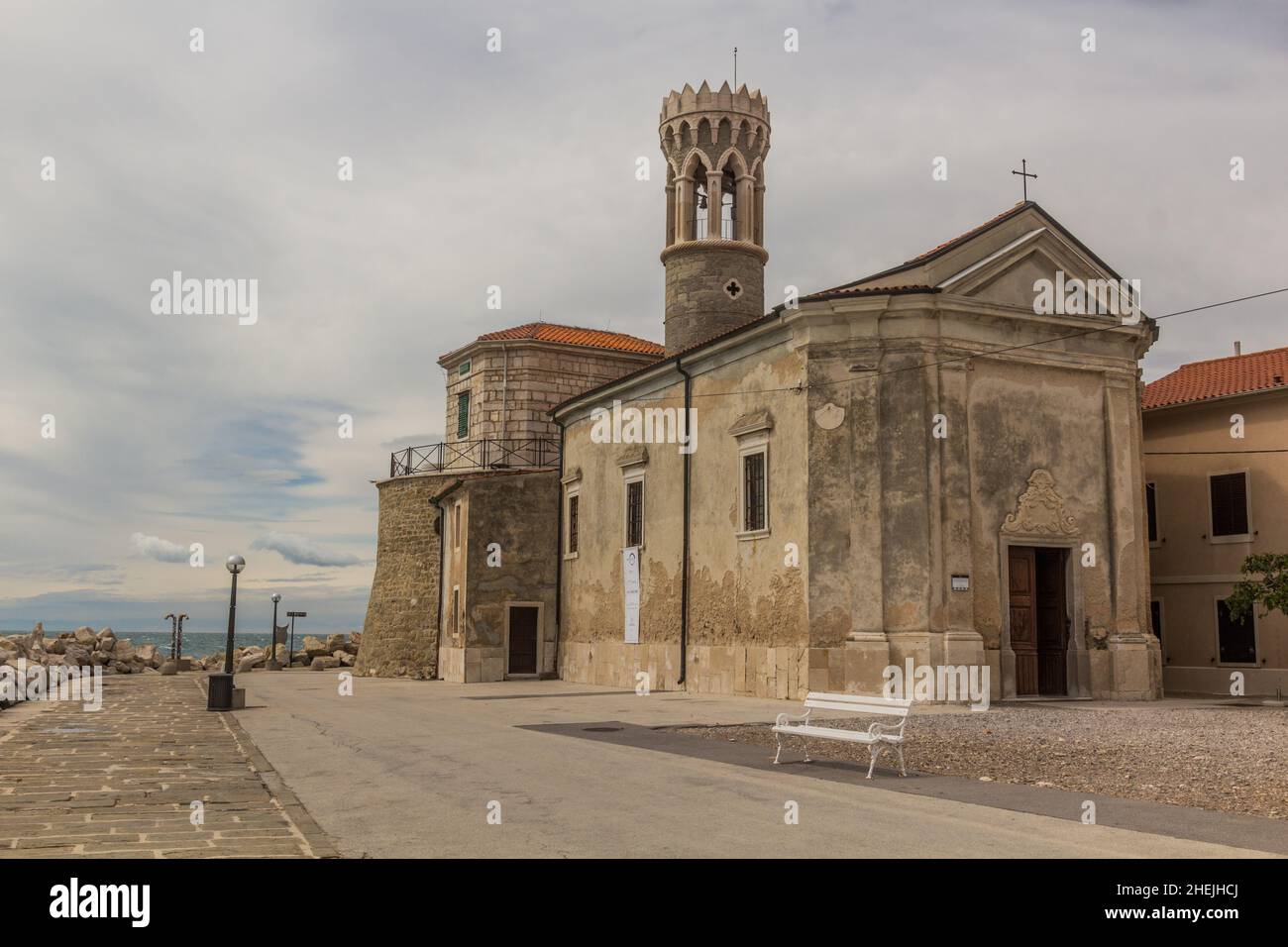 Punta lighthouse and Our Lady of Health Church in Piran town, Slovenia ...