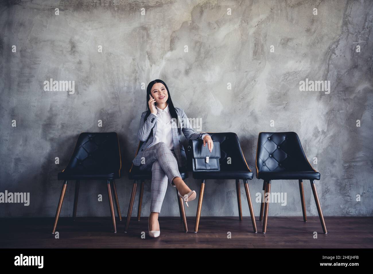 Full length portrait of attractive positive lady sit chair speak ...