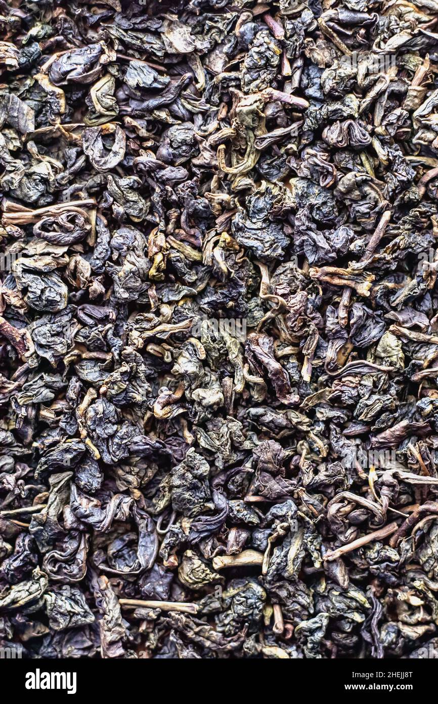 Dried green tea leaves texture, top view Stock Photo - Alamy