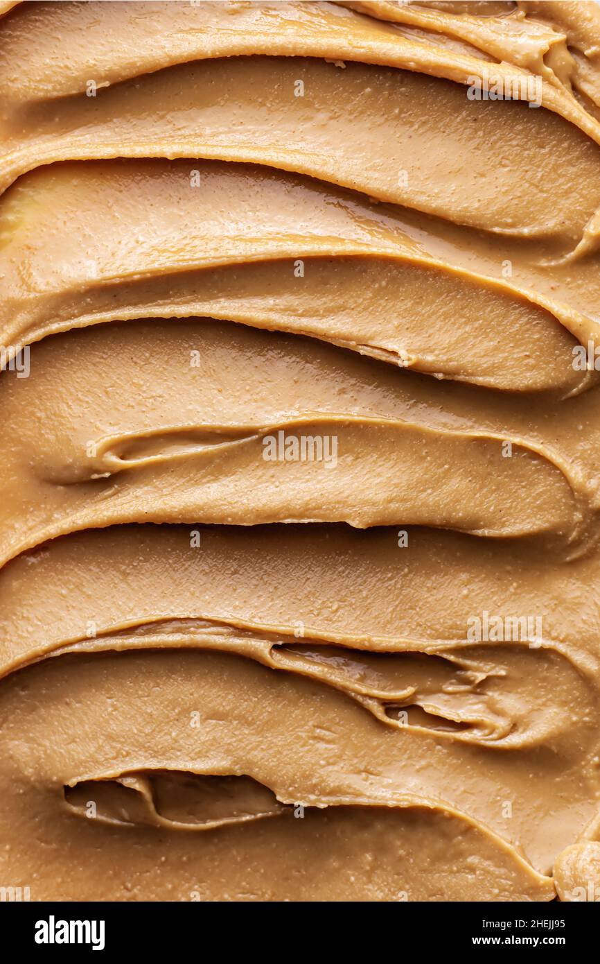 Peanut butter texture, background, top view Stock Photo - Alamy