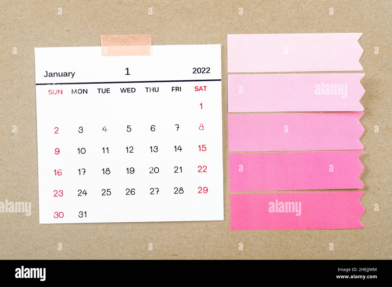 January calendar with blank adhesive note paper on brown background ...