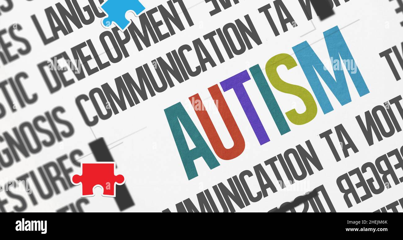 Image of red, green and blue autism awareness puzzles falling over ...