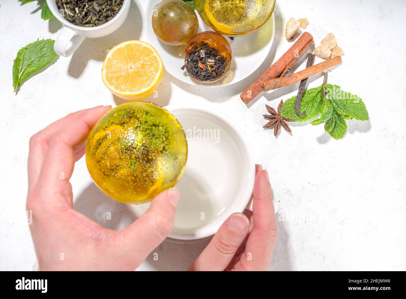 Making tea with Trendy modern tea ball bombs. Tea balls with dried tea ...