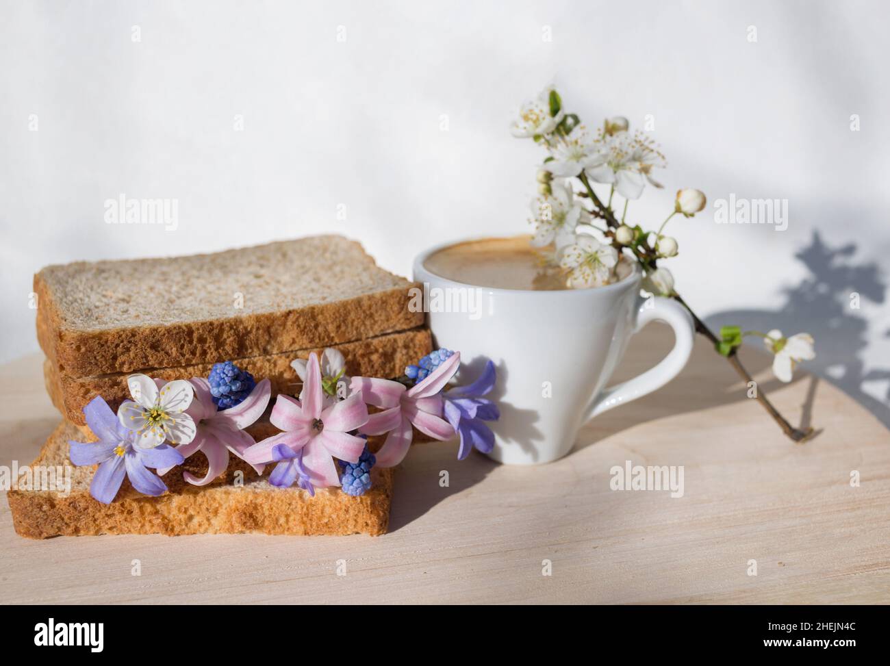 Fried toast bread with spring flowers and a cup of coffee - a beautiful ...