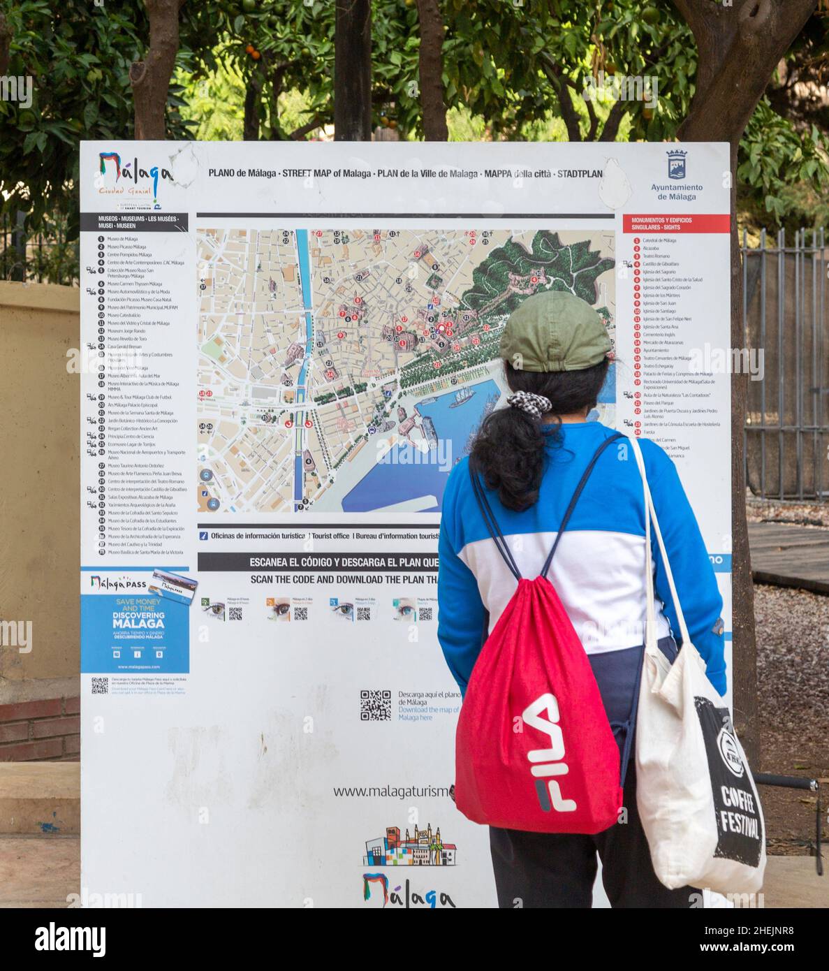 Person looking at plan map of city centre of Malaga, Andalusia, Spain ...
