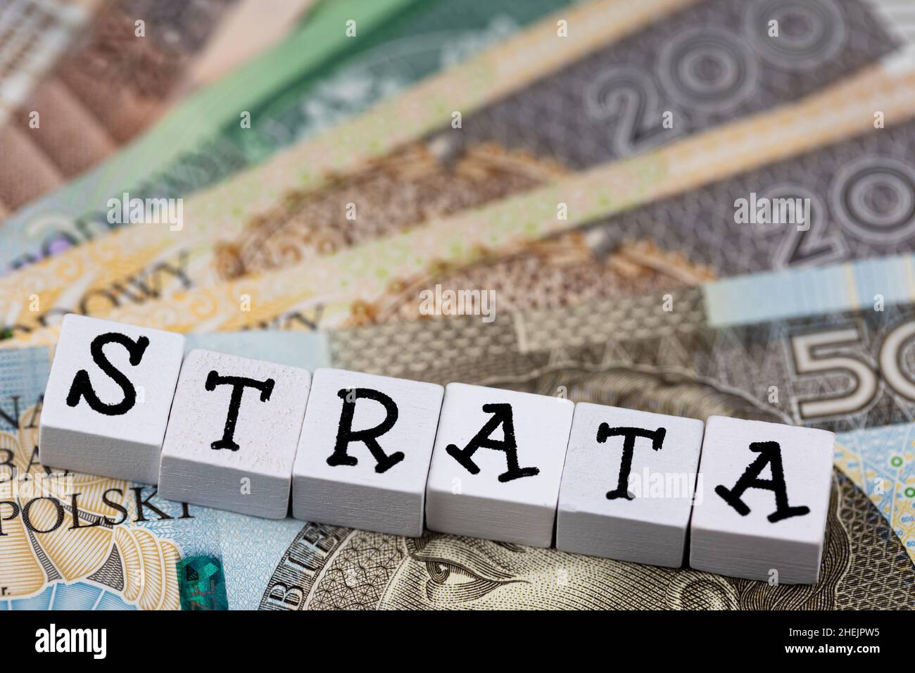 The wording "Strata" translated as "Loss" plus many Polish banknotes ...