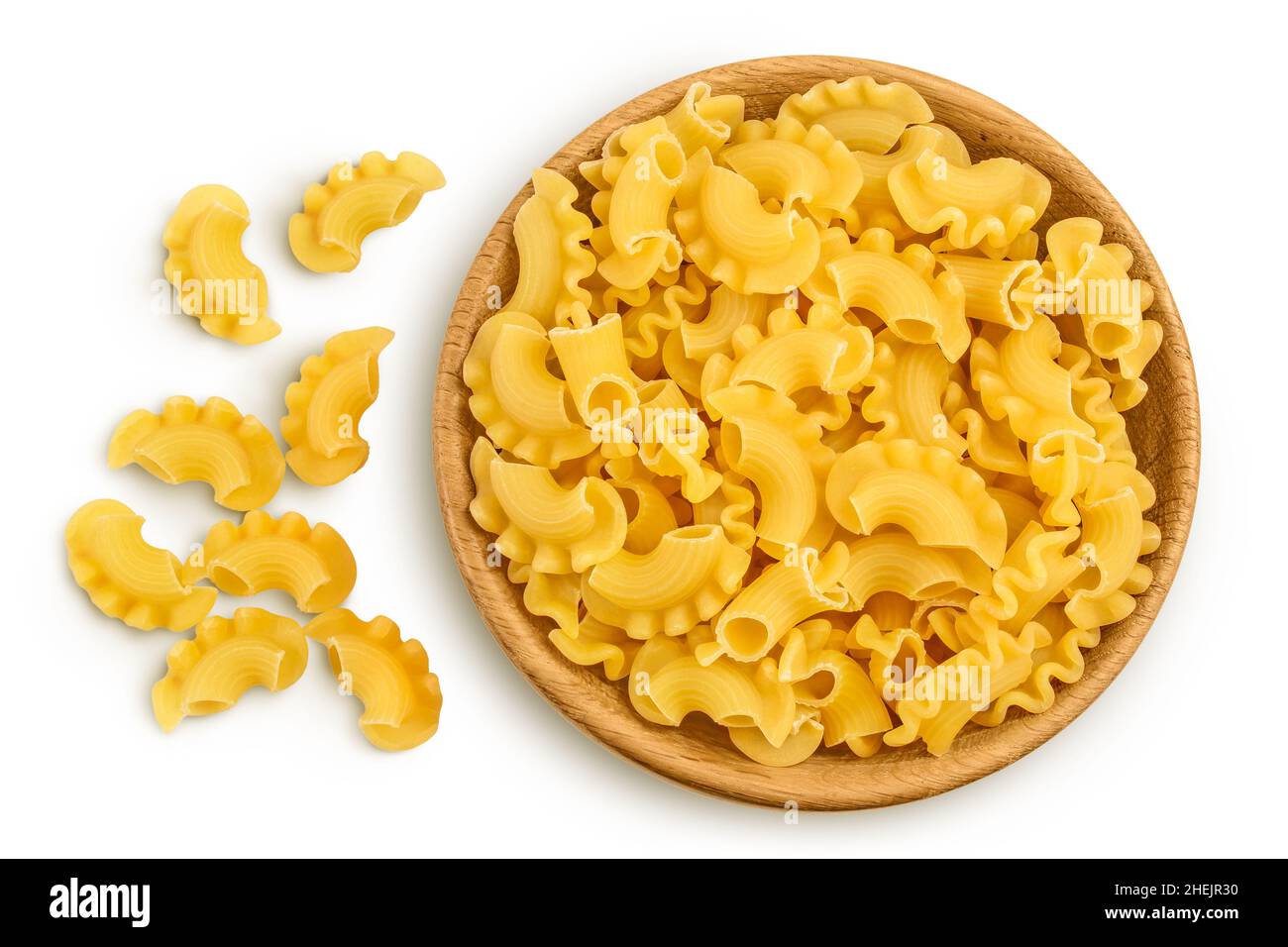 Pasta cornetti creste macaroni in wooden bowl isolated on white ...