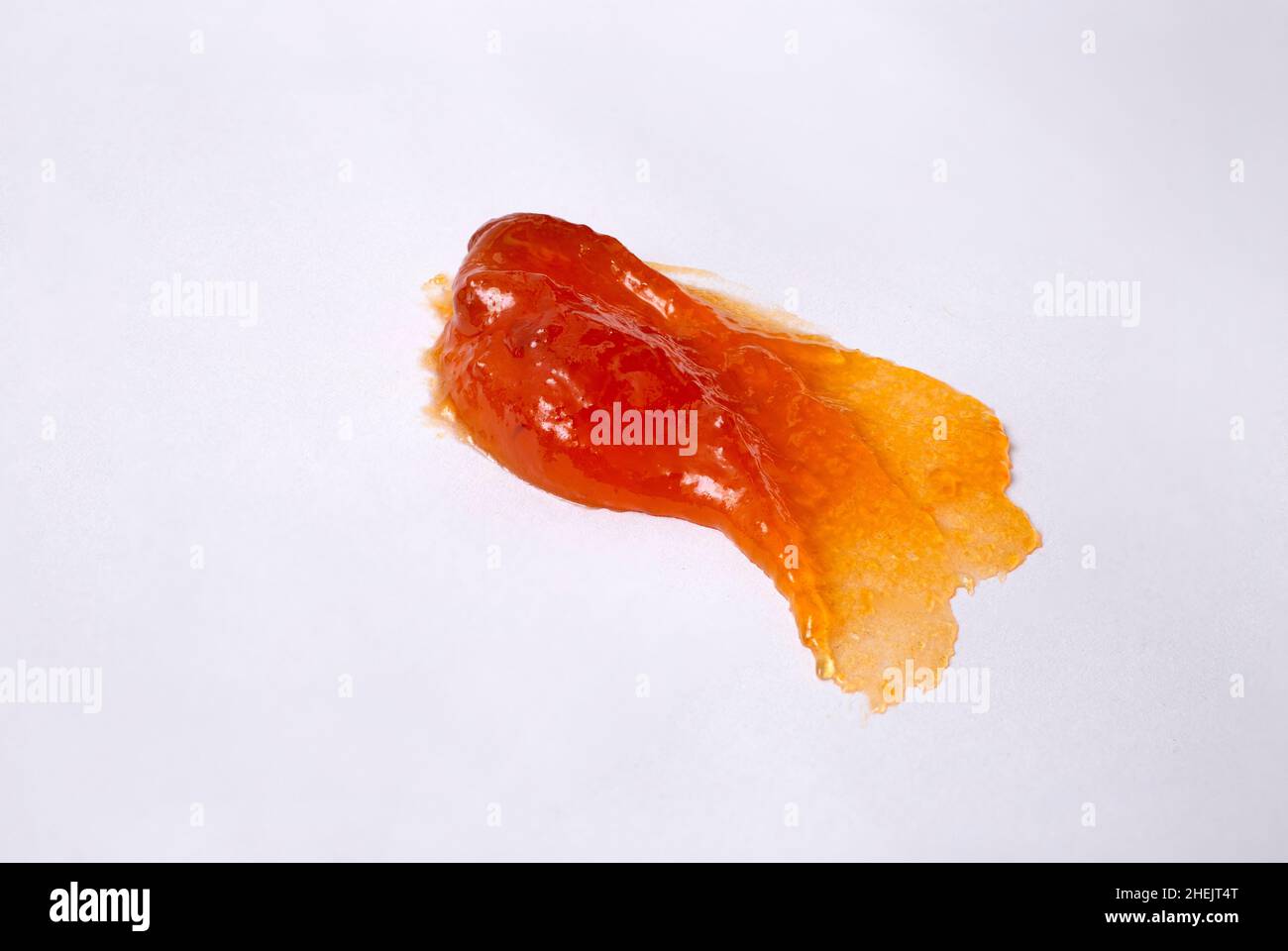 peach jam smear isolated on white background Stock Photo - Alamy