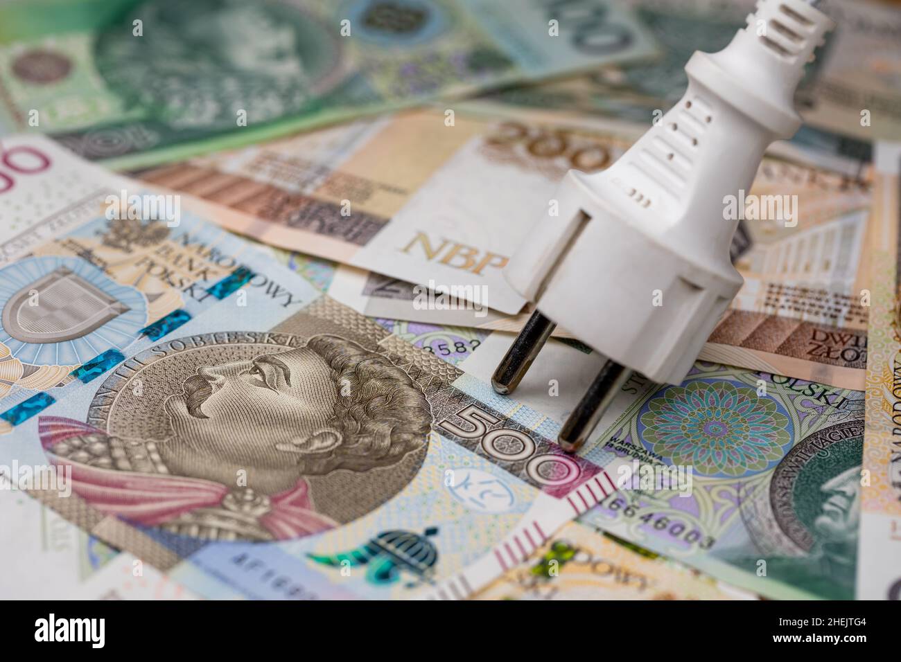 Electric cable with socket and many Polish banknotes. Rise of ...