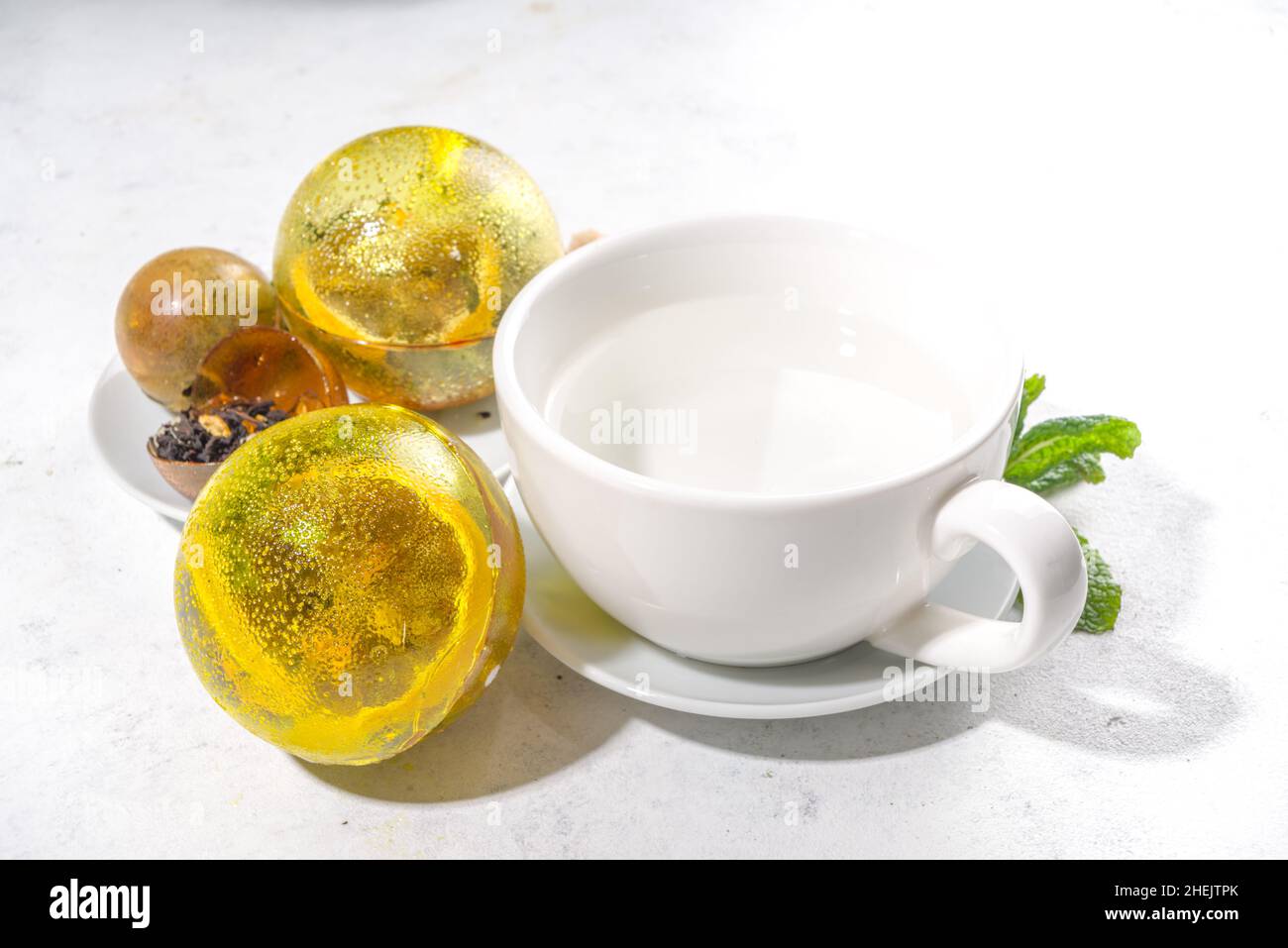 Making tea with Trendy modern tea ball bombs. Tea balls with dried tea ...