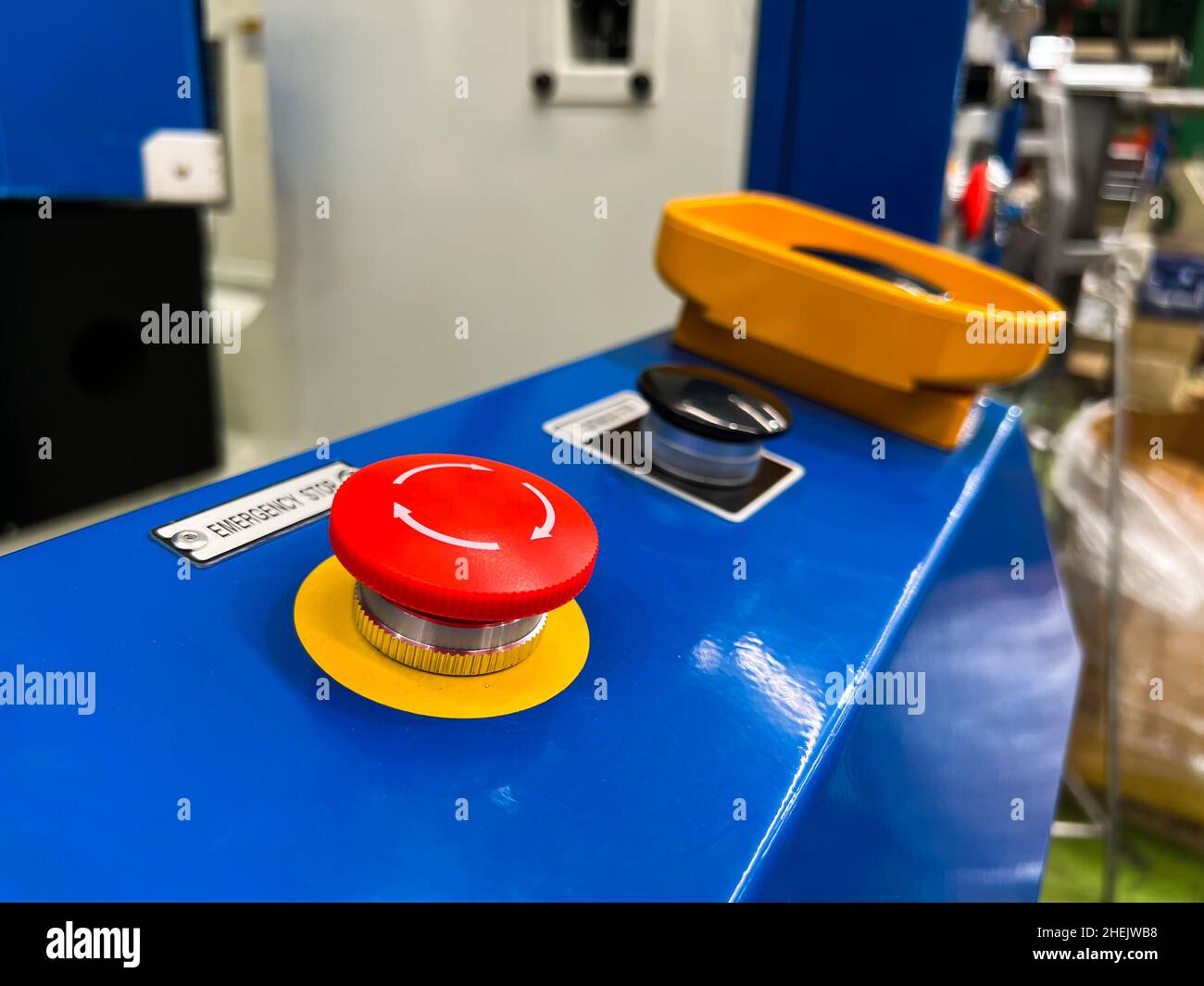The Emergency stop button on control cabinet of press machine Stock ...