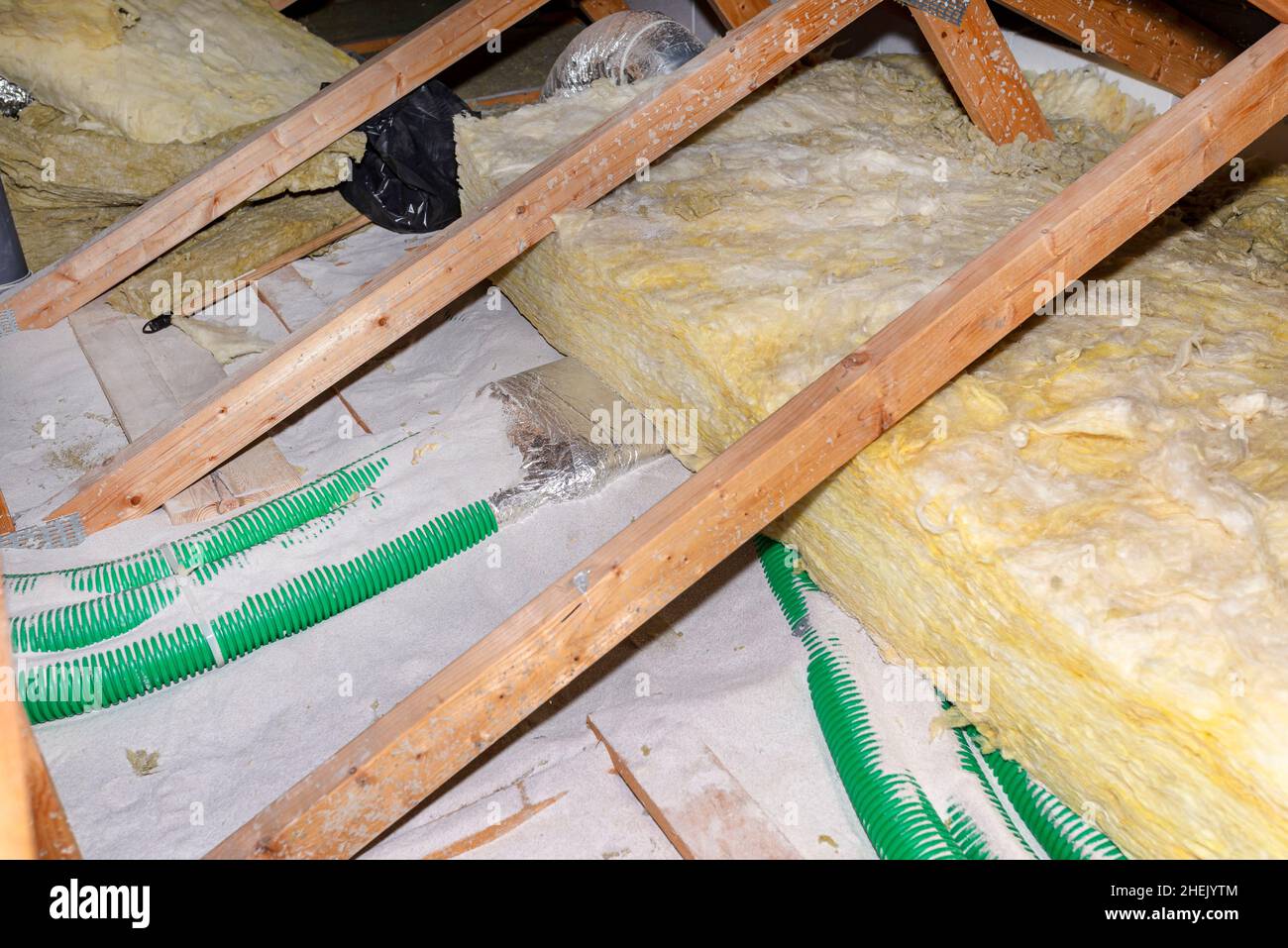 Expanded perlite and mineral wool insulation laid on pipes in domestic ...