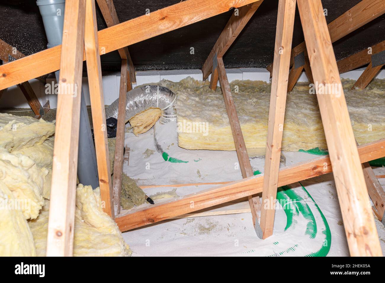 Expanded perlite and mineral wool insulation laid on pipes in domestic ...