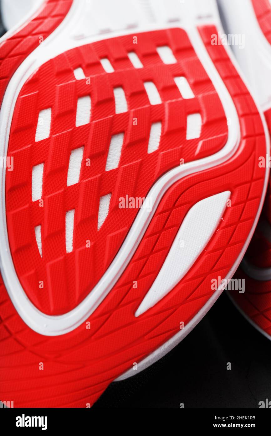 Close-up of the sole of a sport running shoe for running in red Sports ...