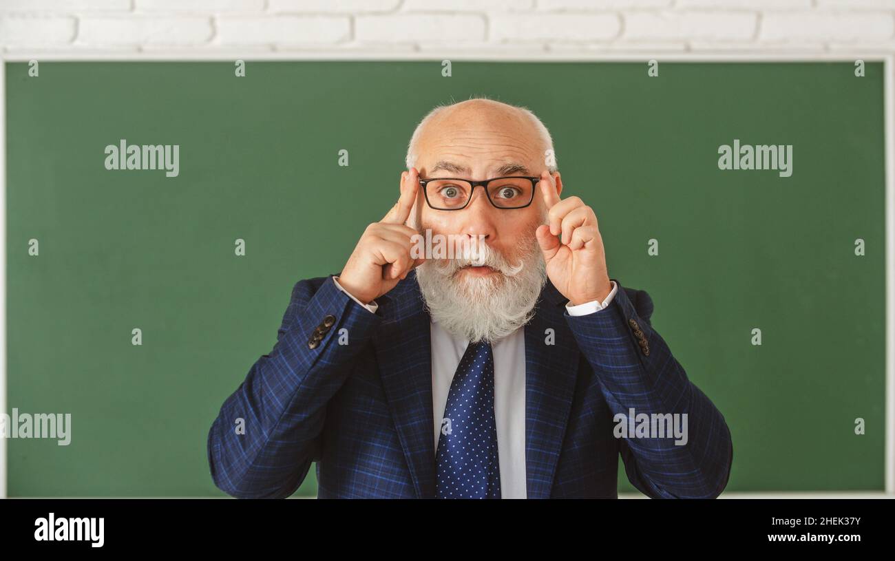 Funny senior professor in glasses. Surprised grey hair professor near ...