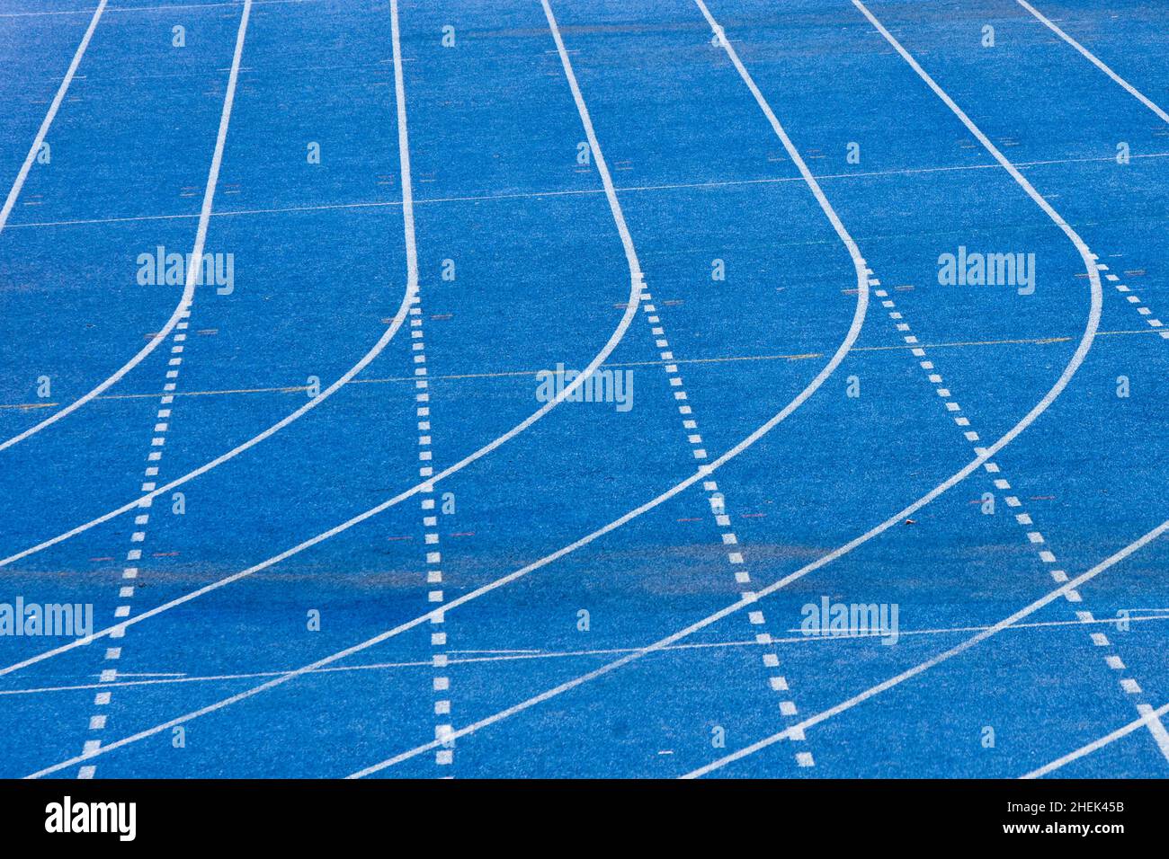 Blue athletics track Stock Photo - Alamy