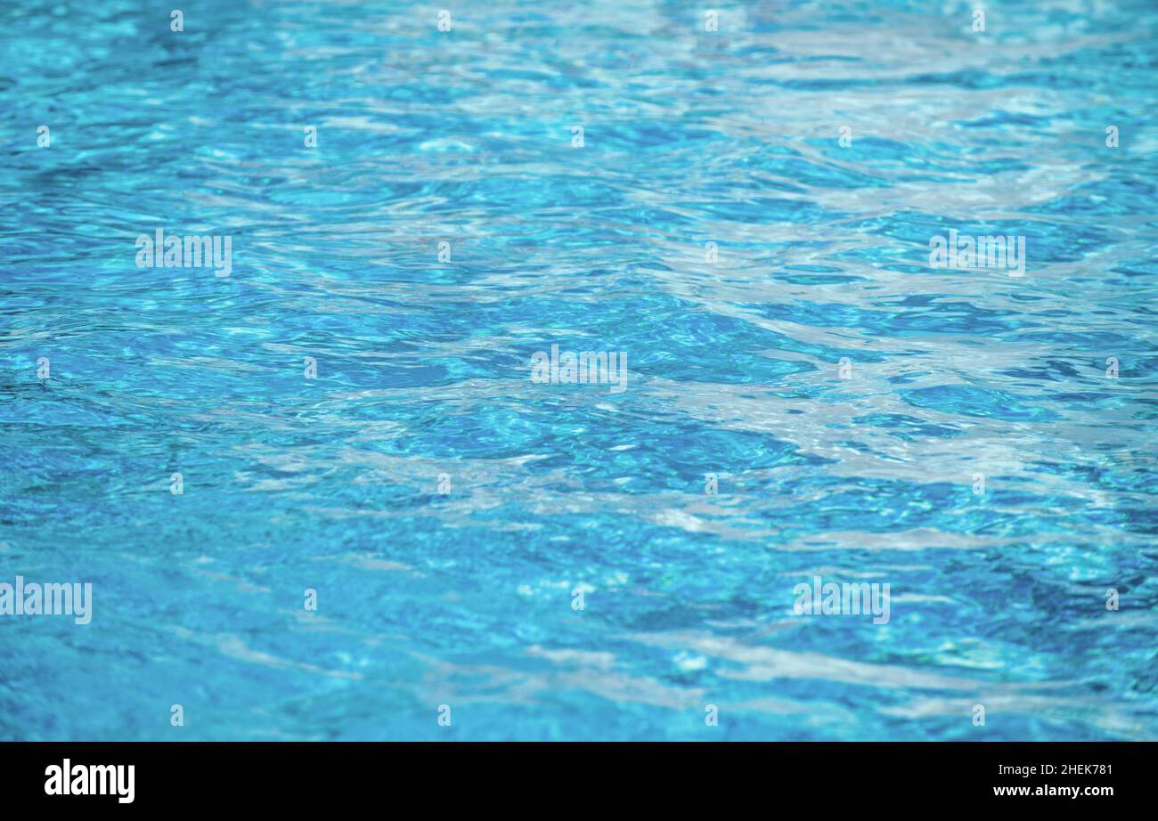 Abstract ripple wave and clear turquoise water surface in swimming pool ...
