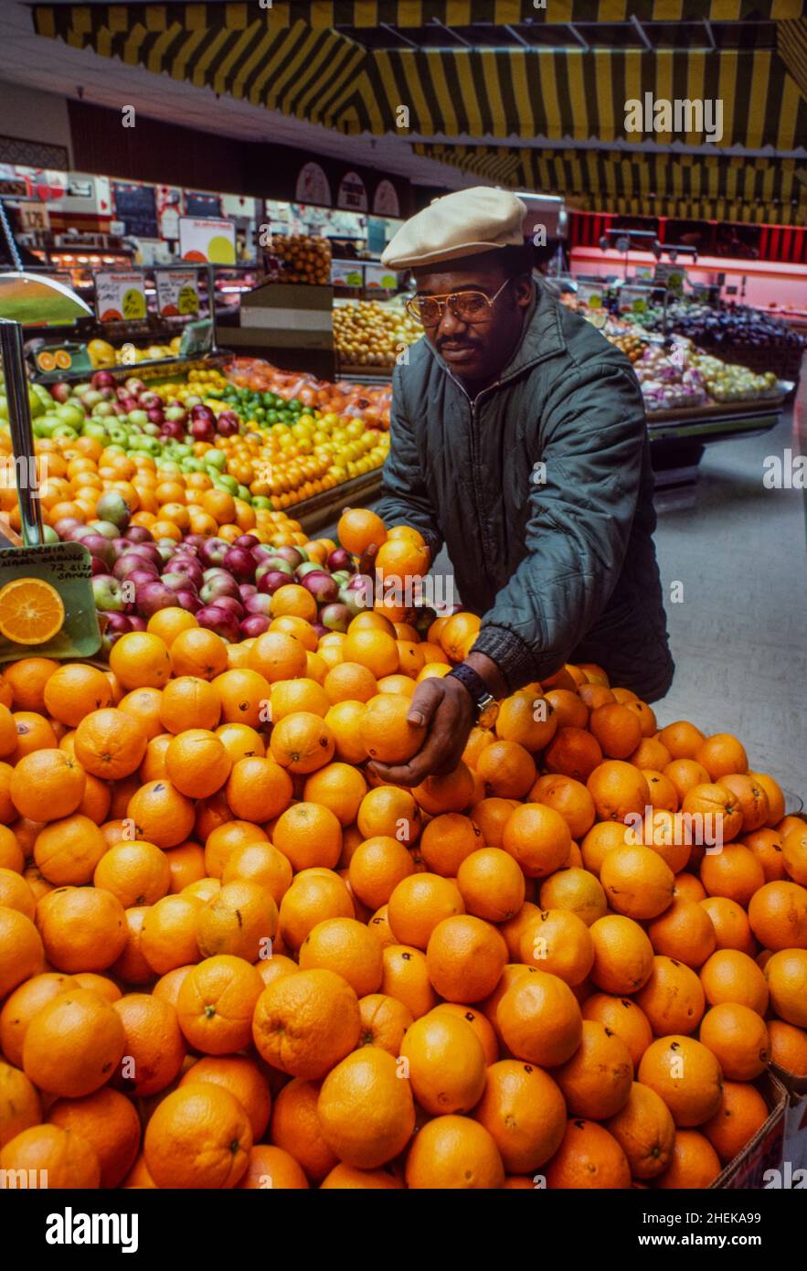 man buying oranges in small local grocery store in New Jersey Stock ...